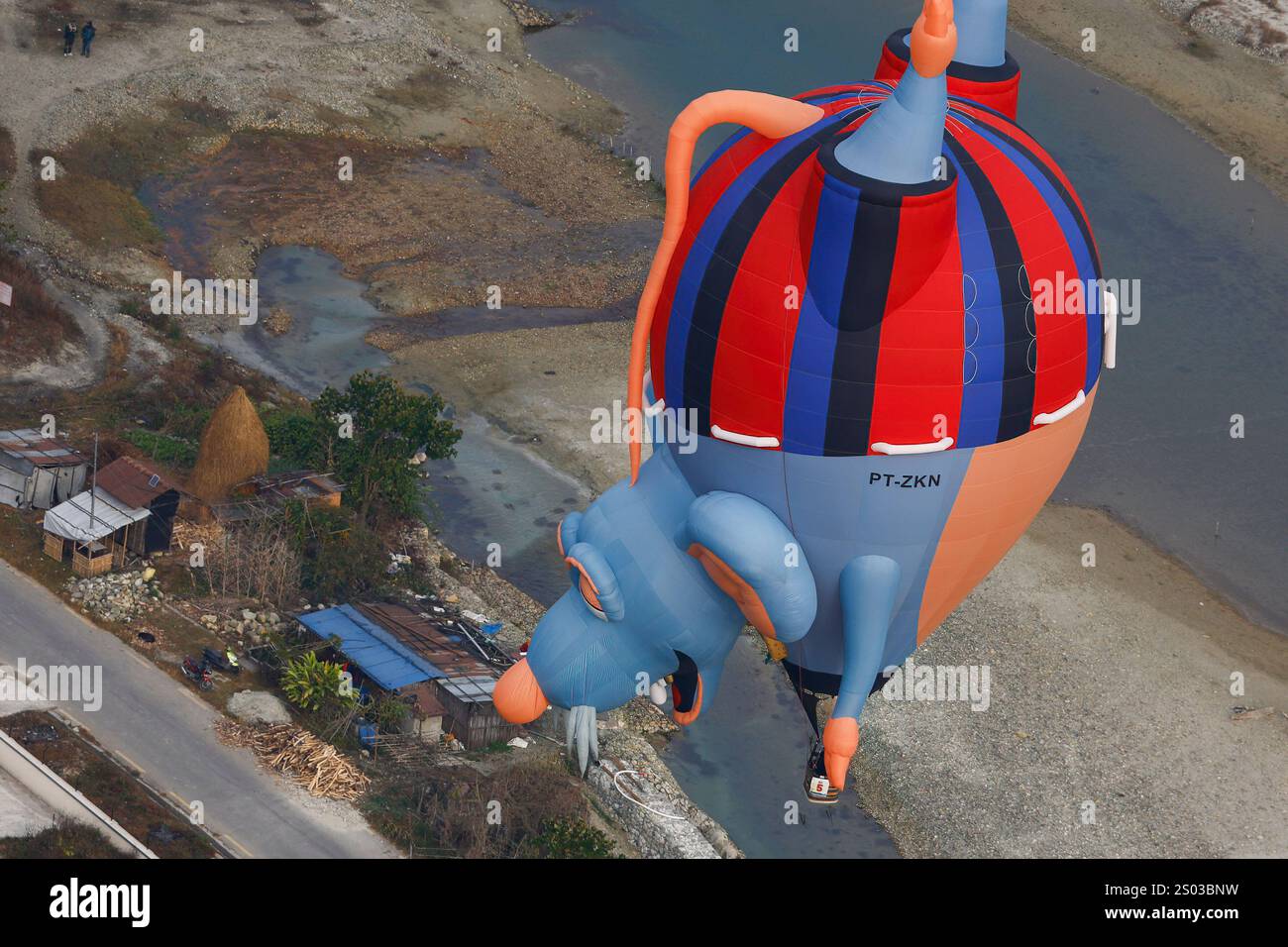 Pokhara, Nepal. 24th Dec, 2024. A hot air balloon soars above Pame on ...