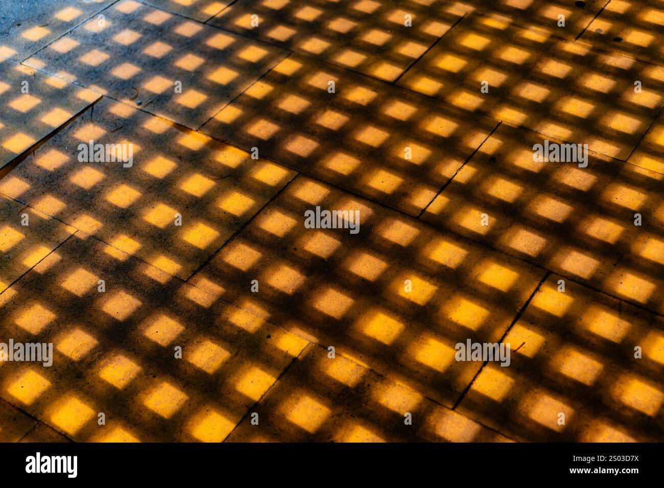 A pattern of squares on a floor, with the squares being a mix of light ...