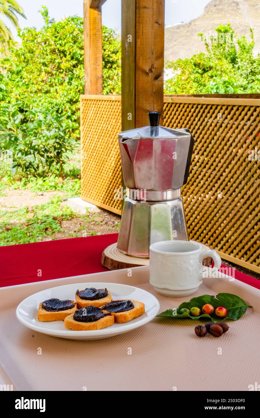 a traditional coffee maker with a coffee cup and 4 slices of bread with ...