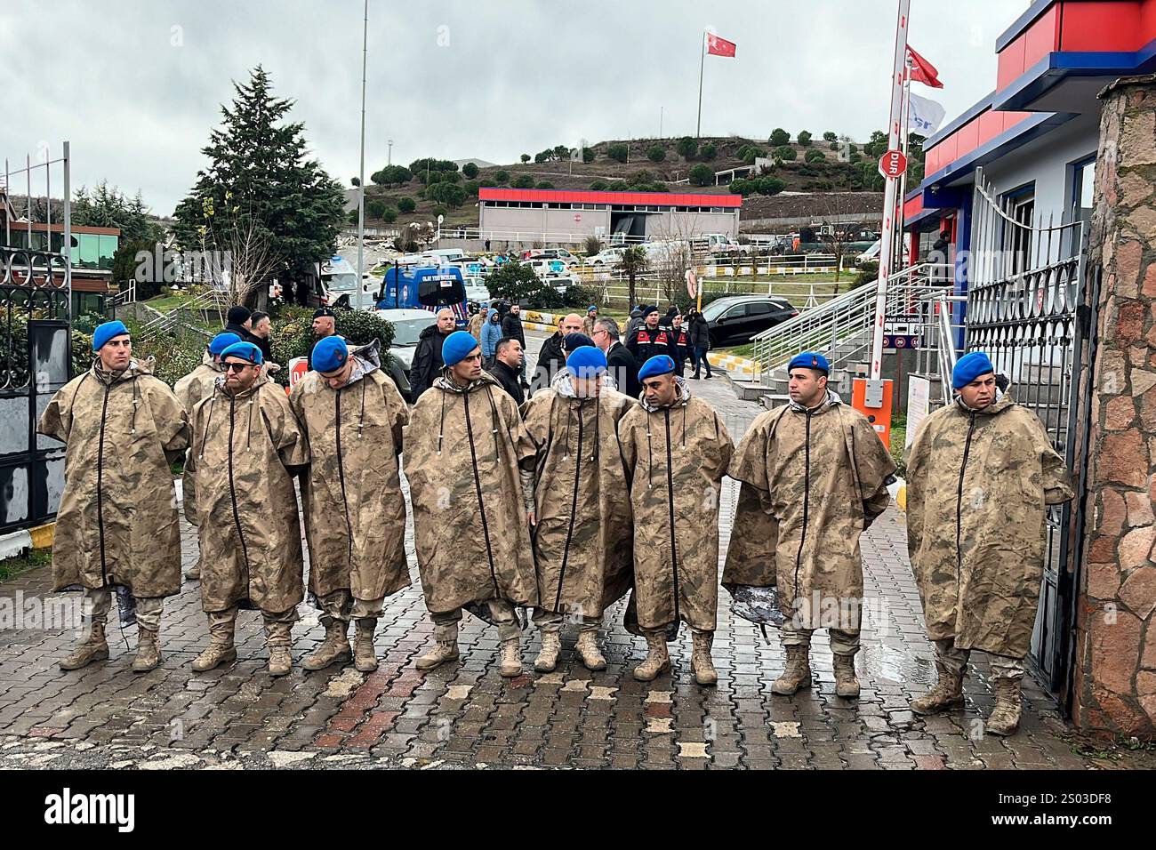 Turkish security forces stand guard next to parked ambulances at the ...