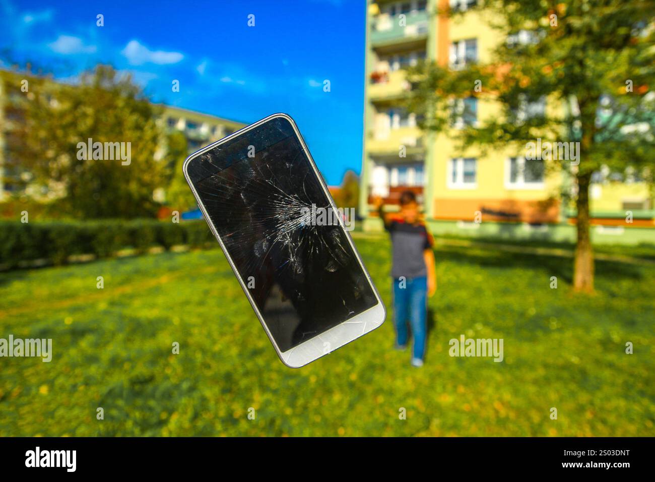 A teenager throws his phone in anger, a broken phone thrown by a ...