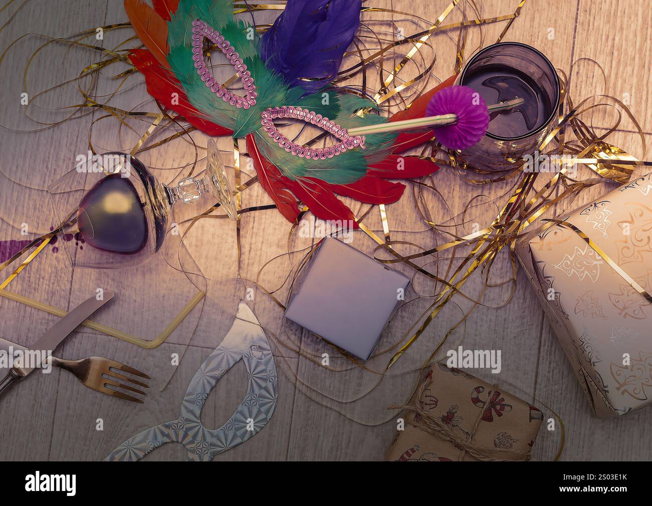 Festive masks, colorful streamers, and gifts are spread out on the ...