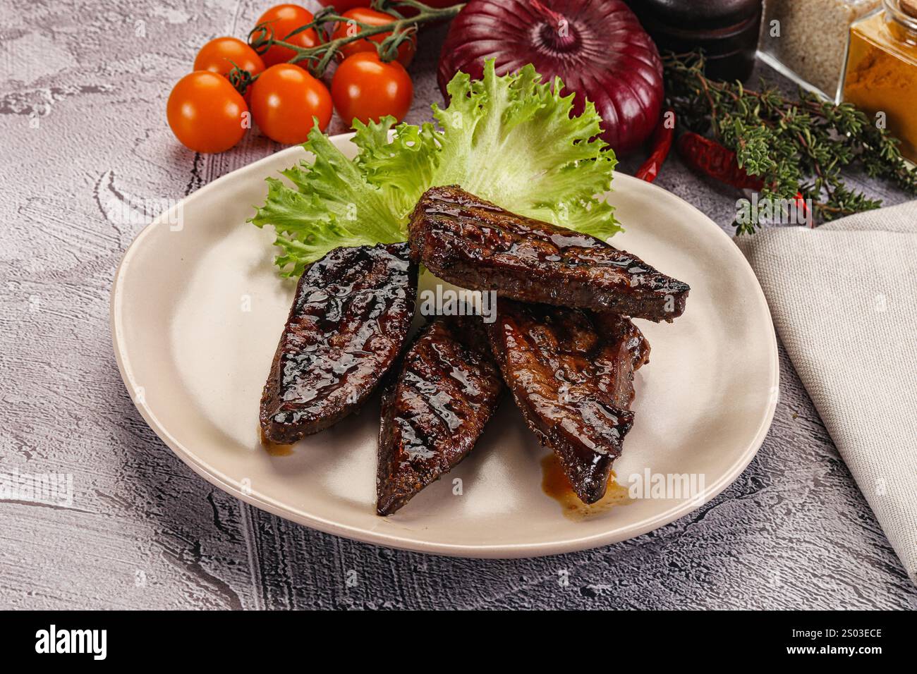Grilled diet beef liver steak in the plate Stock Photo - Alamy