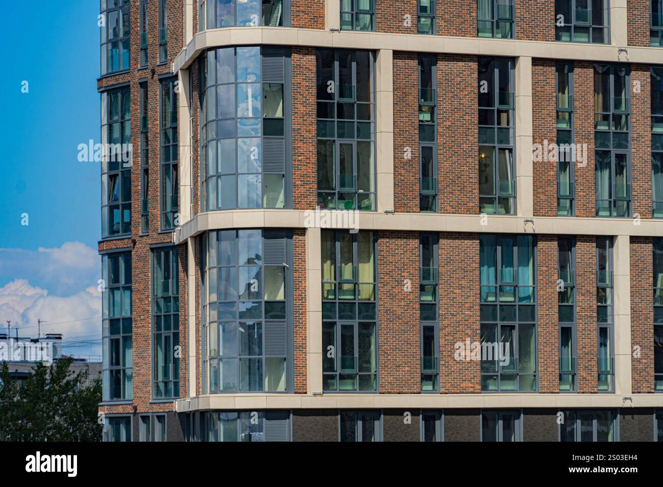 New building facade in housing complex. Modern style in architecture ...