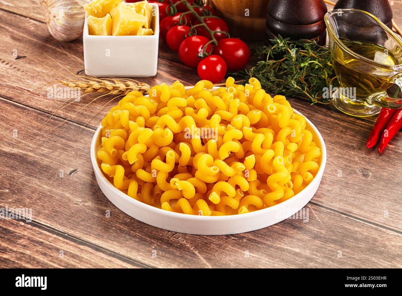 Italian cuisine - dry cellentani pasta for cooking Stock Photo - Alamy
