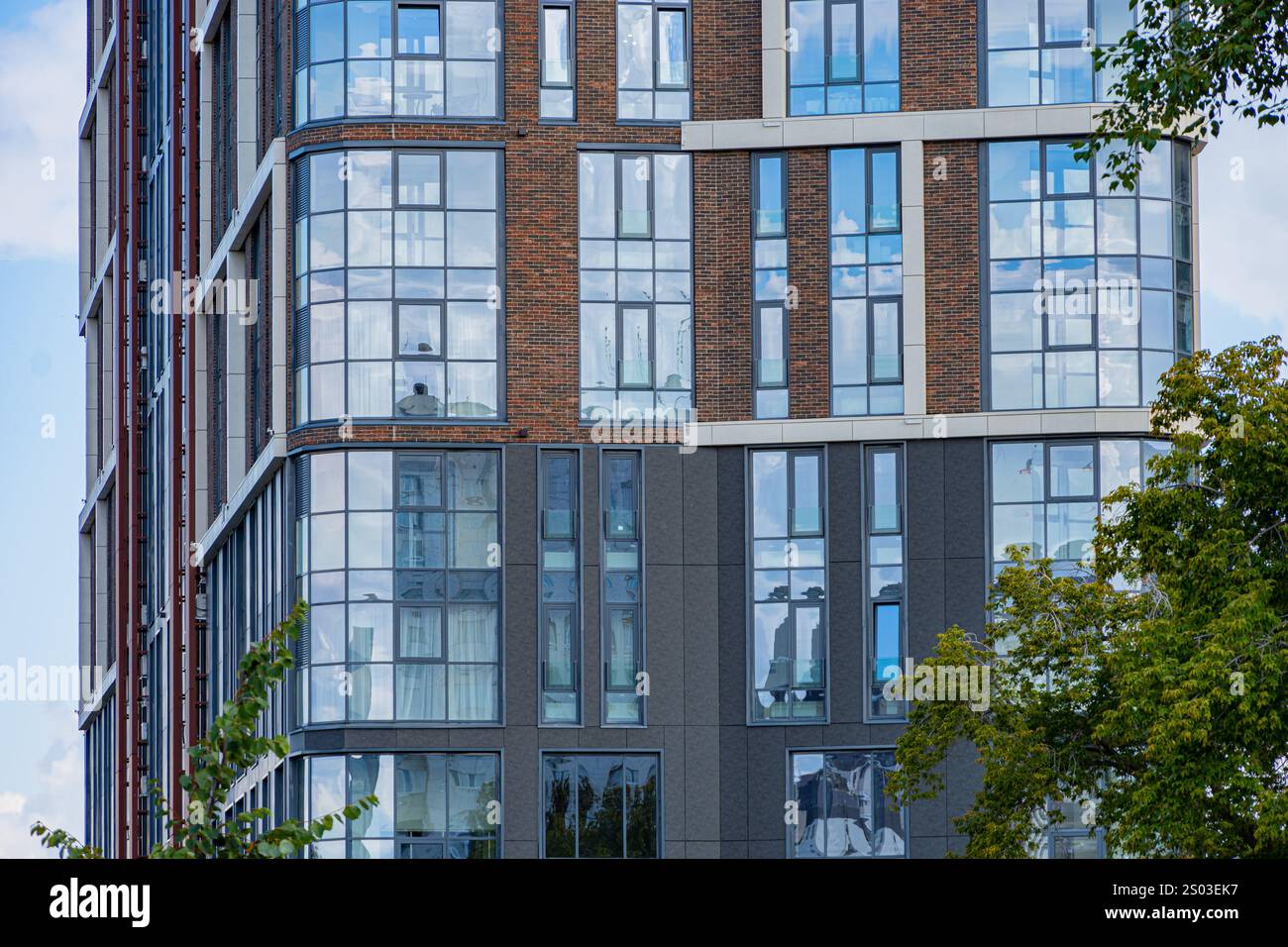 New building facade in housing complex. Modern style in architecture ...