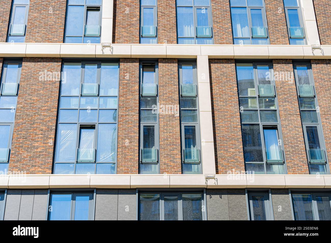 New building facade in housing complex. Modern style in architecture ...