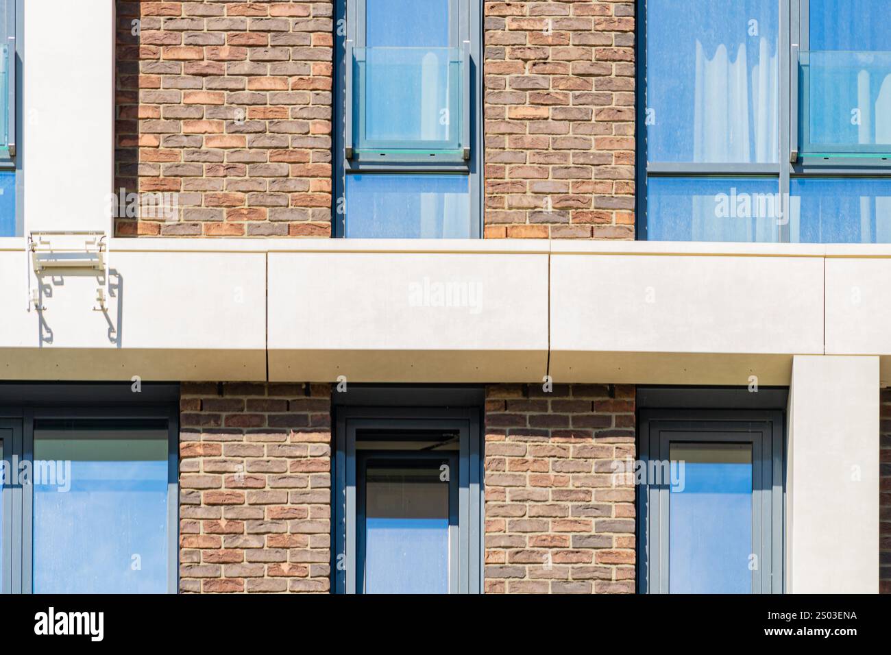 New building facade in housing complex. Modern style in architecture ...