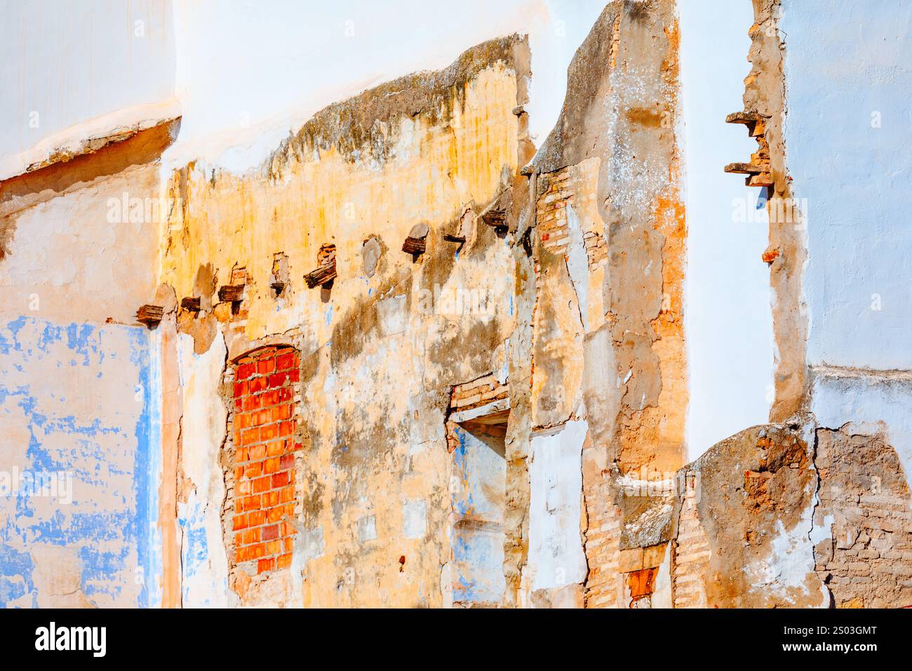 Deteriorating wall shows visible signs of decay and weathering. Wall ...
