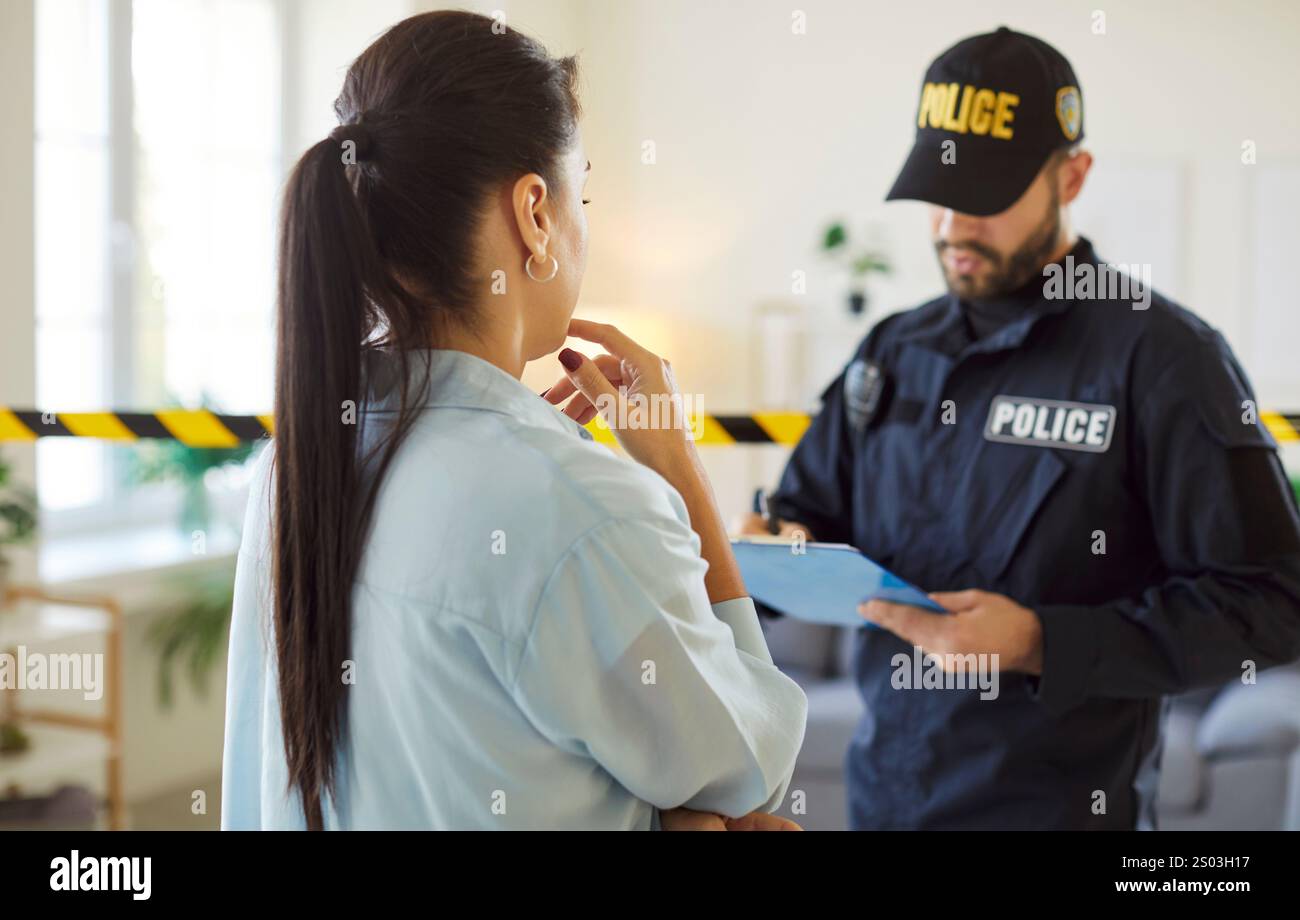 Police Officer Takes Statement From a Witness in a Crime Scene ...