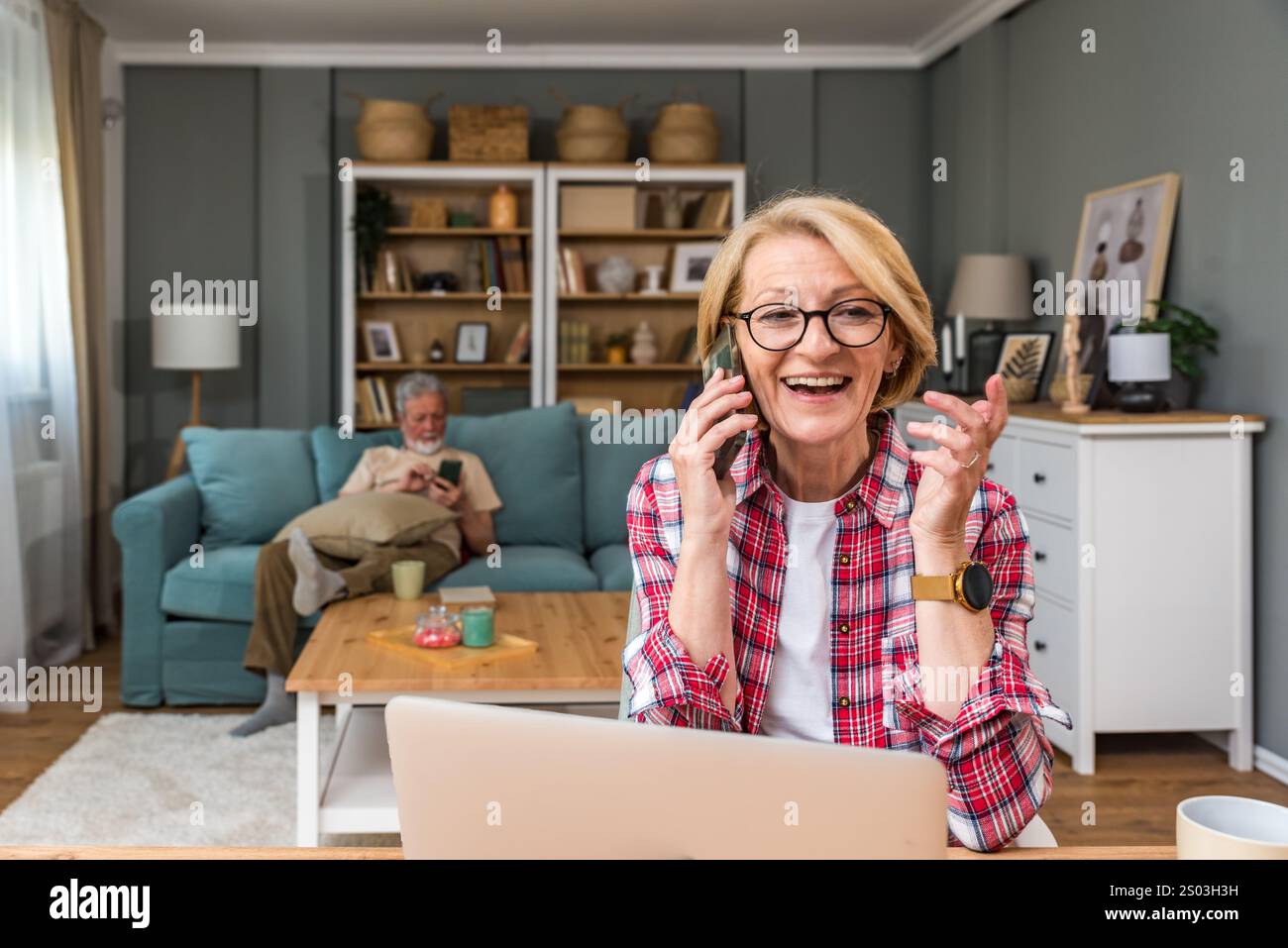 Simple life. Senior couple, elderly woman calling workers on the phone ...