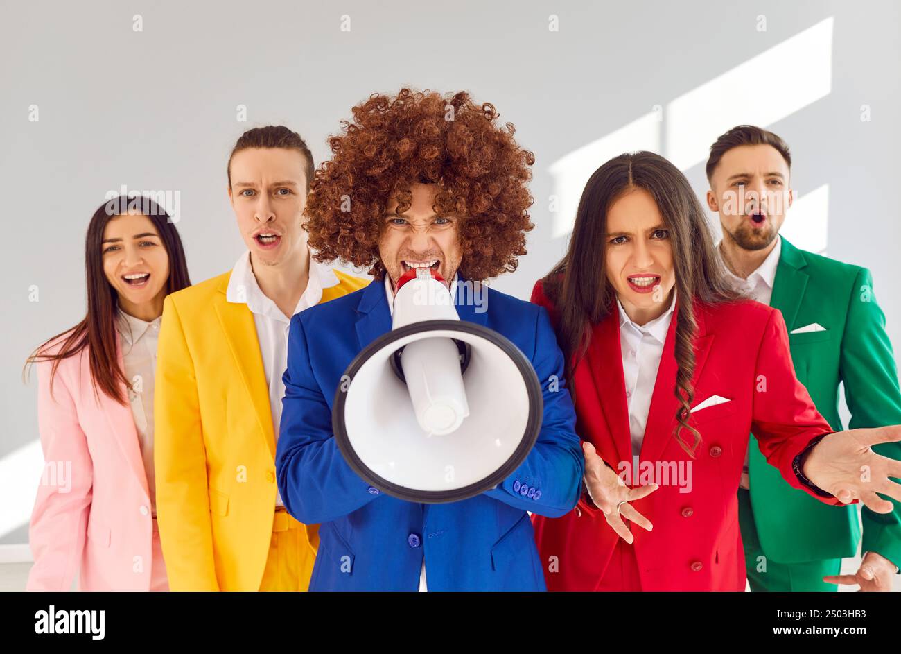 Group of Businessmen in Colorful Suits Shouting into Megaphone Stock ...