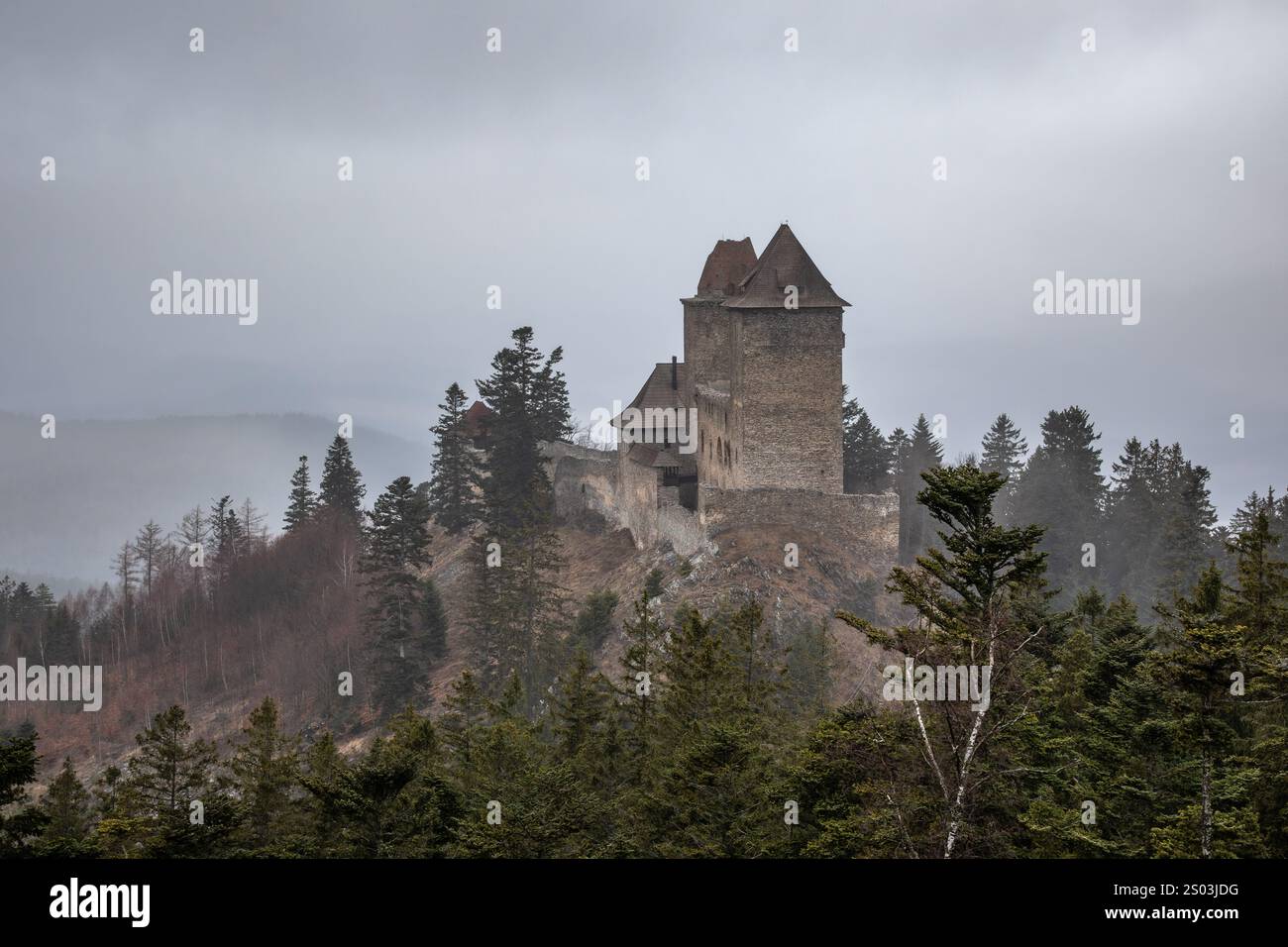 Kasperk Castle in Hilly Nature during Misty Day in Czech Republic. View ...
