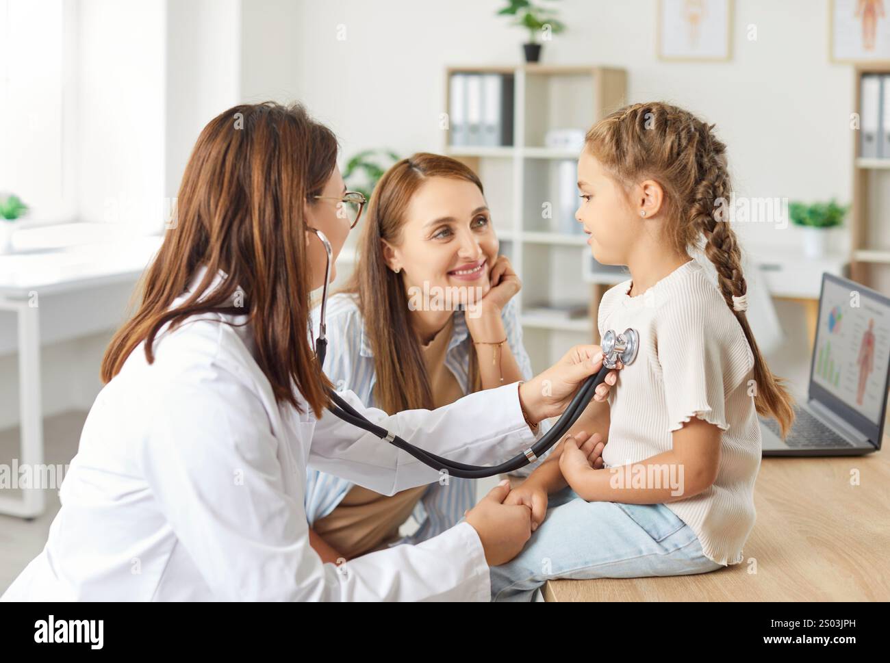 Pediatrician, female pediatrist doctor with stethoscope listening to ...
