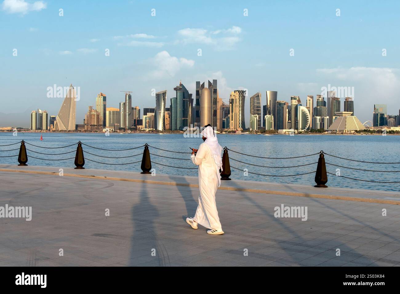 Arab Men Infront of Doha Skyline Mina port Qatar Stock Photo - Alamy