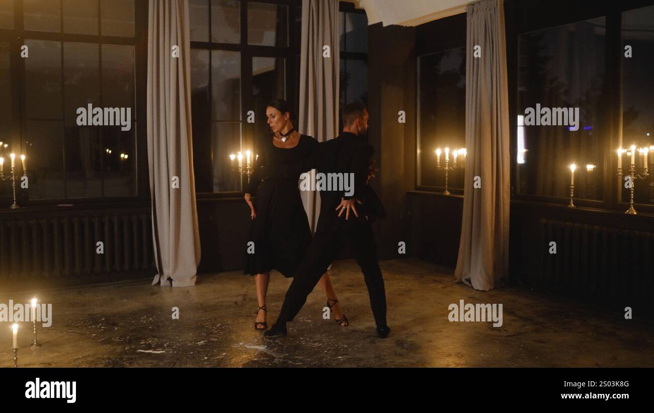 Sensual dance of beautiful couple by candlelight. Night time European ...