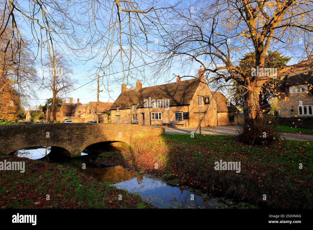 Autumn colours, The Montagu Arms pub, Barnwell village green ...