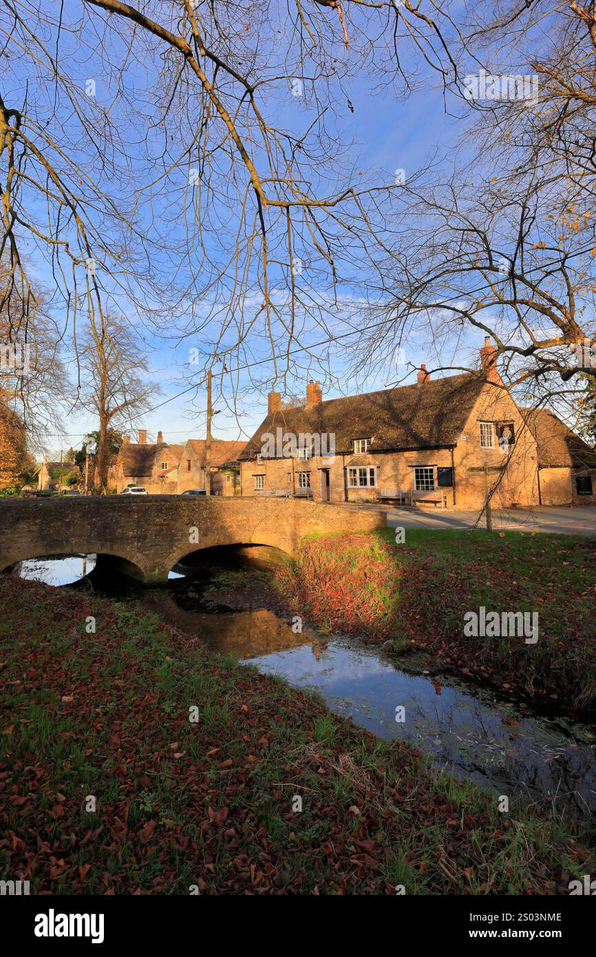 Autumn colours, The Montagu Arms pub, Barnwell village green ...