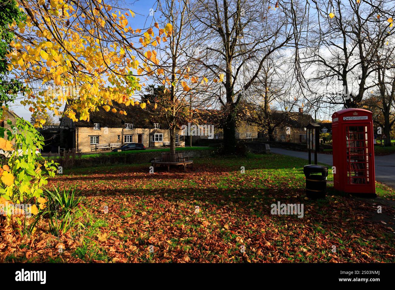 Autumn colours, The Montagu Arms pub, Barnwell village green ...