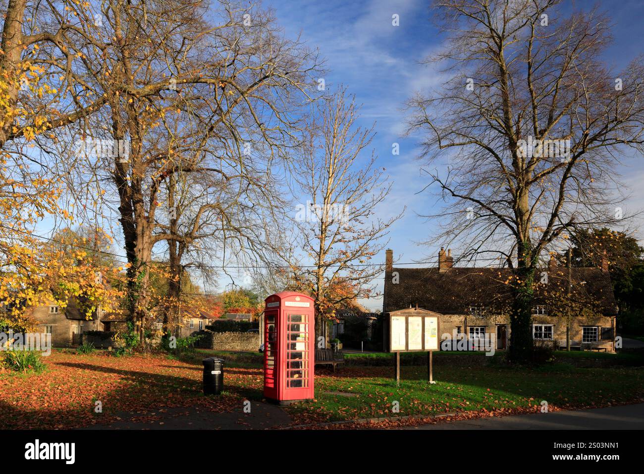 Autumn colours, The Montagu Arms pub, Barnwell village green ...