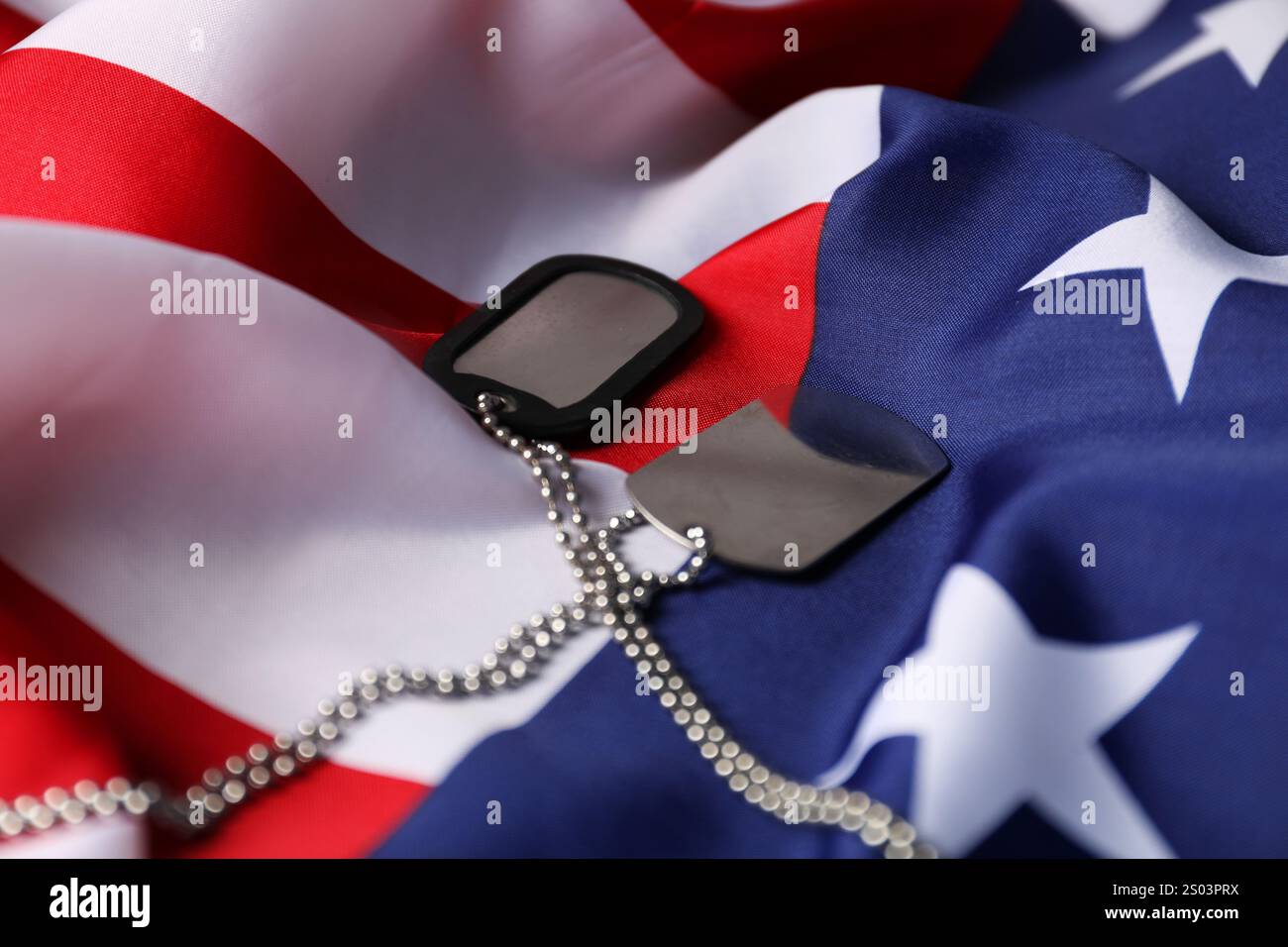 Veterans day. Army tokens and American flag, closeup Stock Photo - Alamy