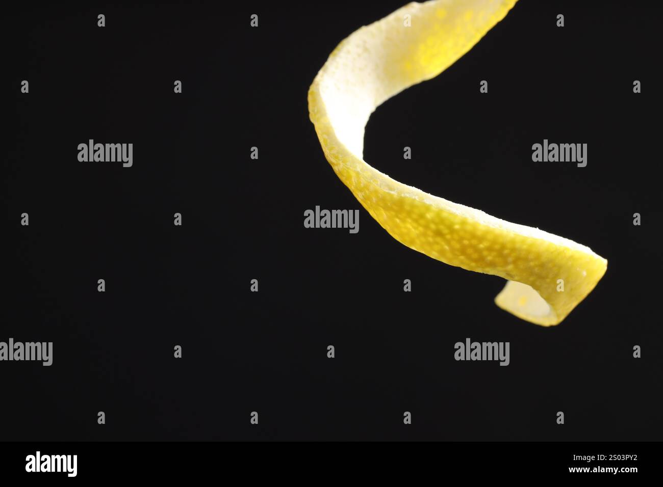 Fresh lemon peel on black background, closeup. Space for text Stock ...