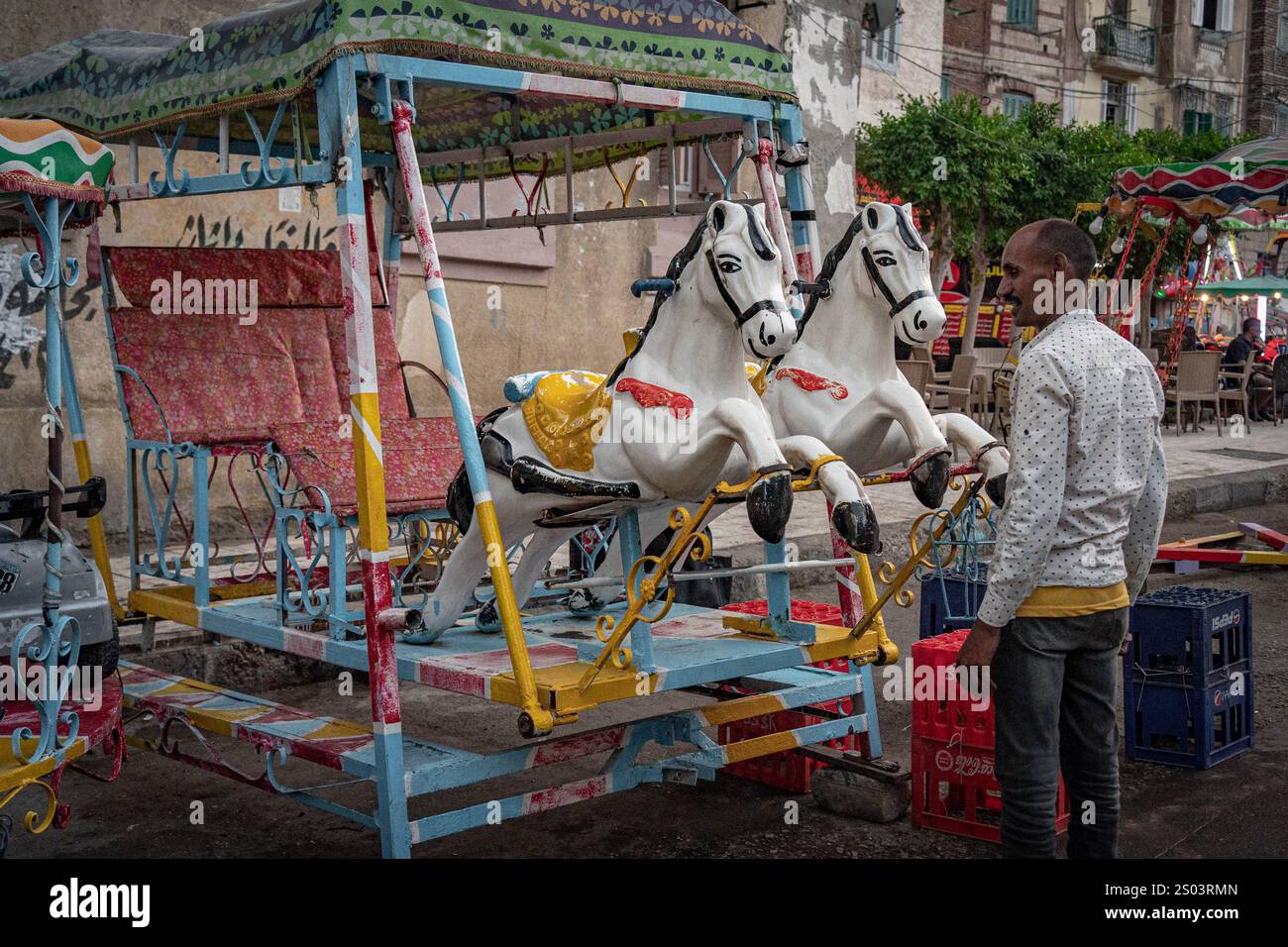 A colorful, vintage children's carousel in the streets of Alexandria ...