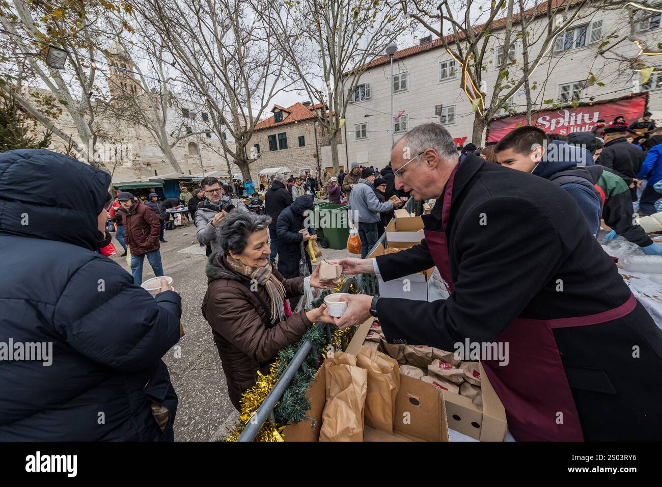 Split, Croatia. 24th Dec, 2024. Mayor of Split Ivica Puljak servers a ...