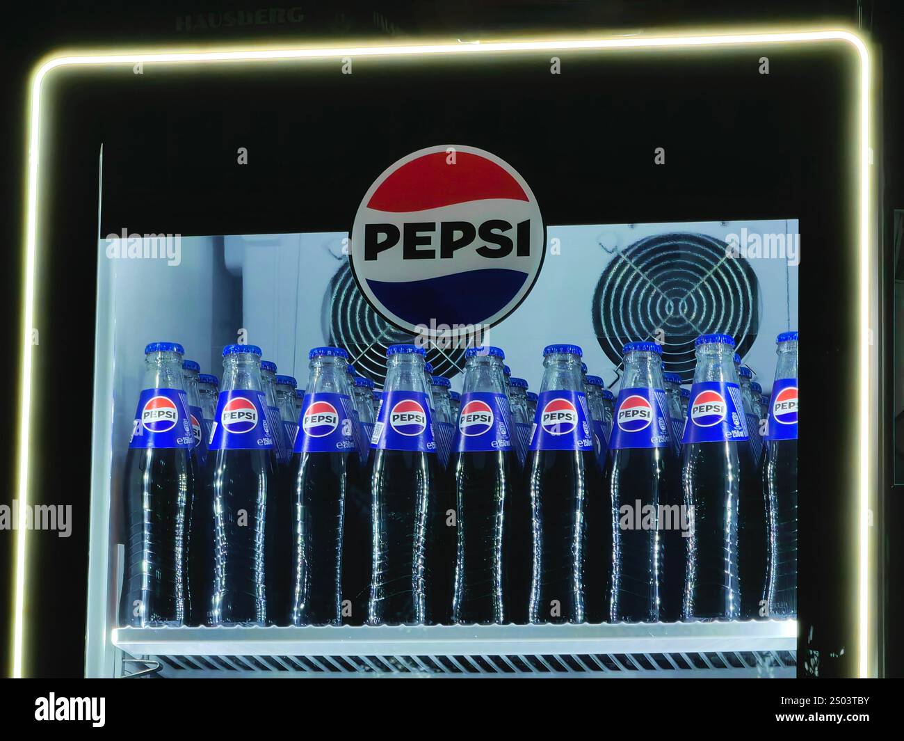 Refreshing Icons: Pepsi Soda Pop in Glass Bottles on an Illuminated ...