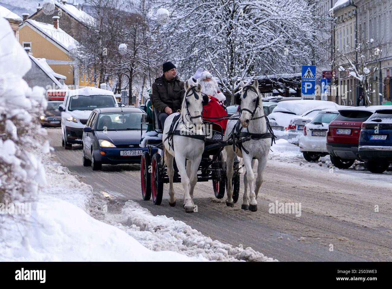 Otocac, Croatia. 24th Dec, 2024. A man dressed as Santa Claus arrives ...