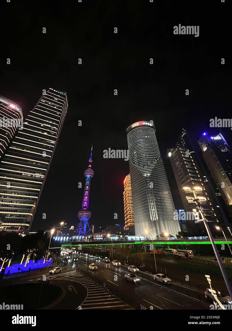 Illuminated skyscrapers and the oriental pearl tower dominate the ...