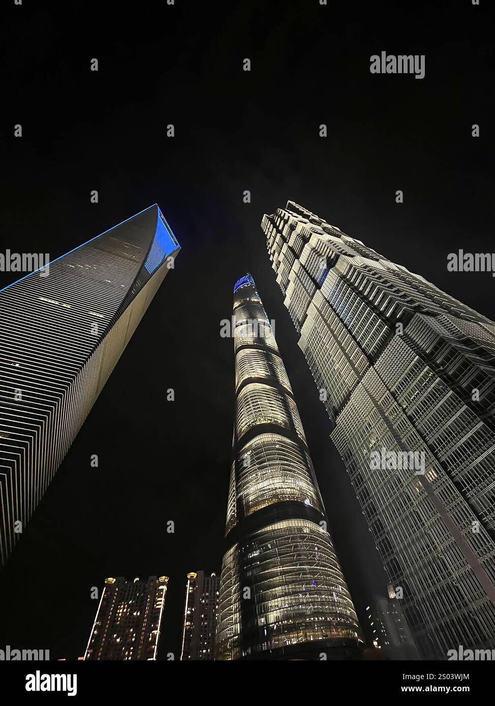 Modern skyscrapers illuminating the night sky in the bustling ...