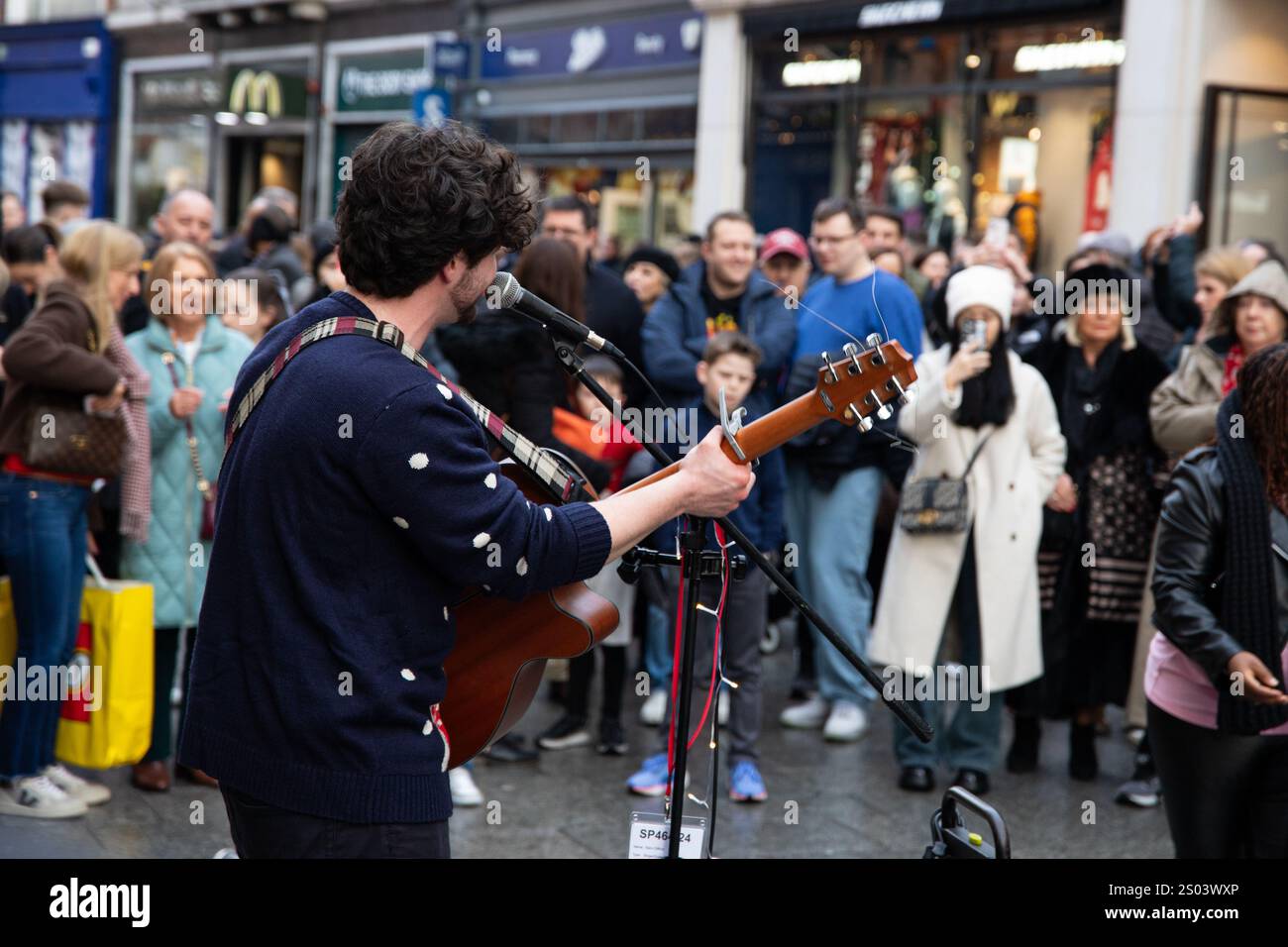 Grafton Street busker Sam Clifford draws in a crowd, as thousands flock ...