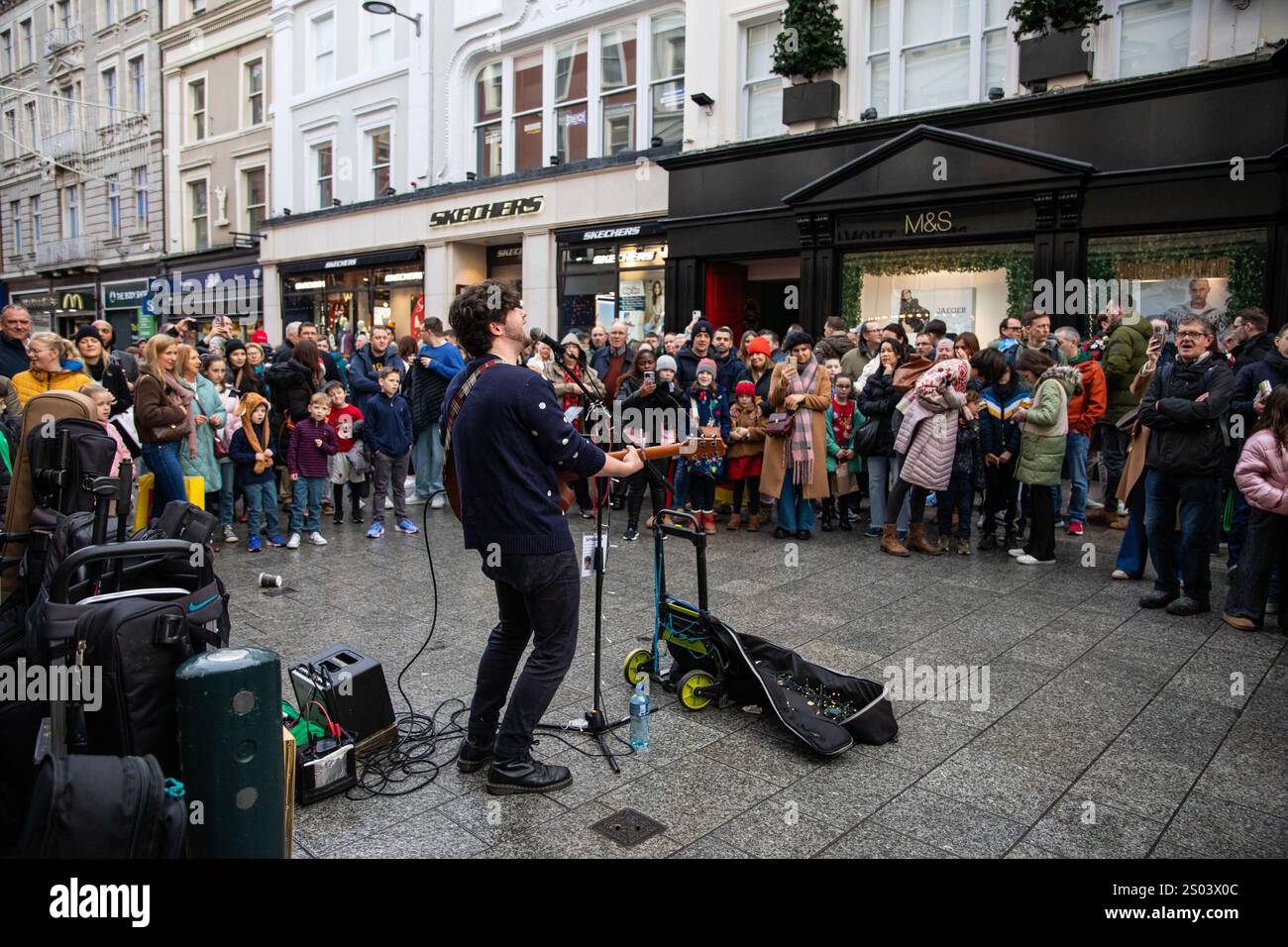 Grafton Street busker Sam Clifford draws in a crowd, as thousands flock ...