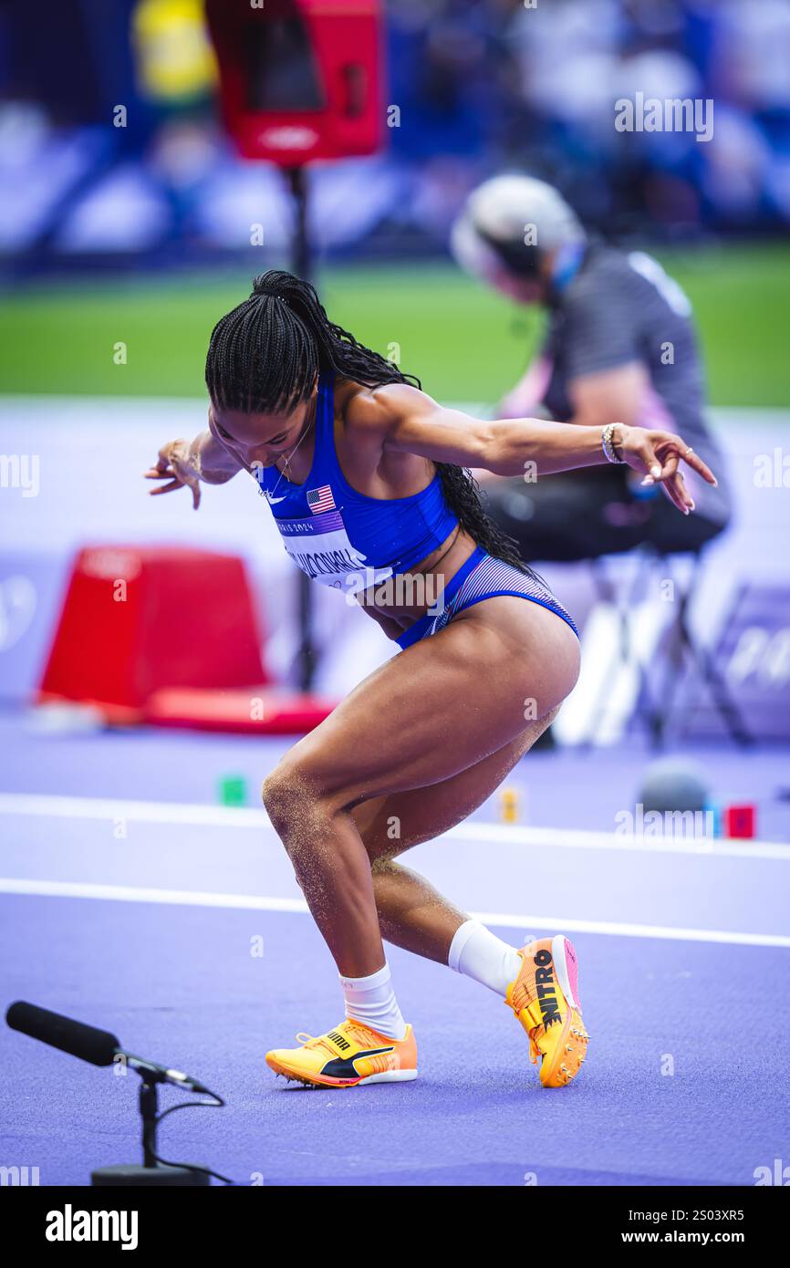 Tara Davis-Woodhall participating in the long jump at the Paris 2024 ...