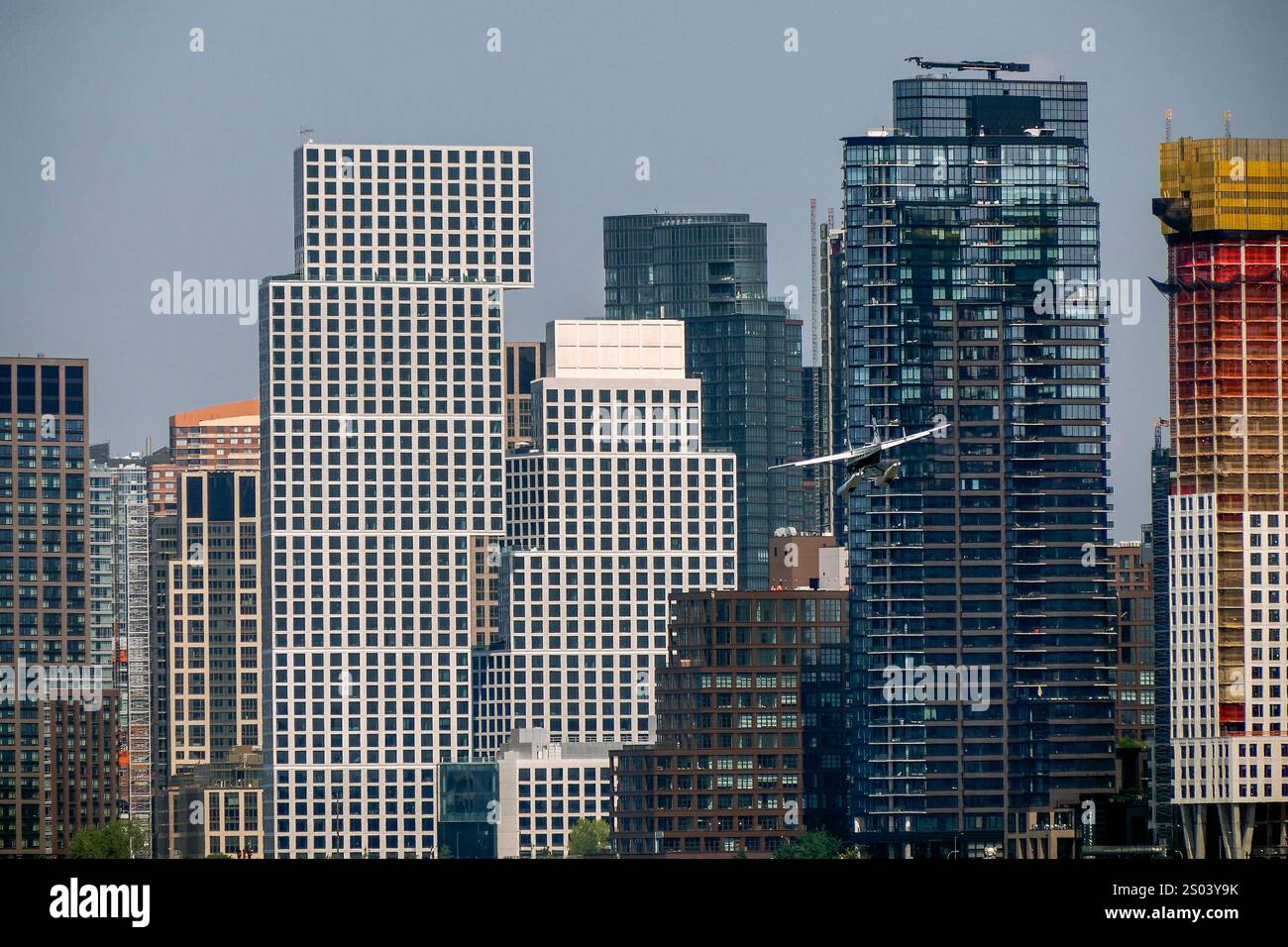 hydroplane plane flying on new york manhattan view from East river boat ...