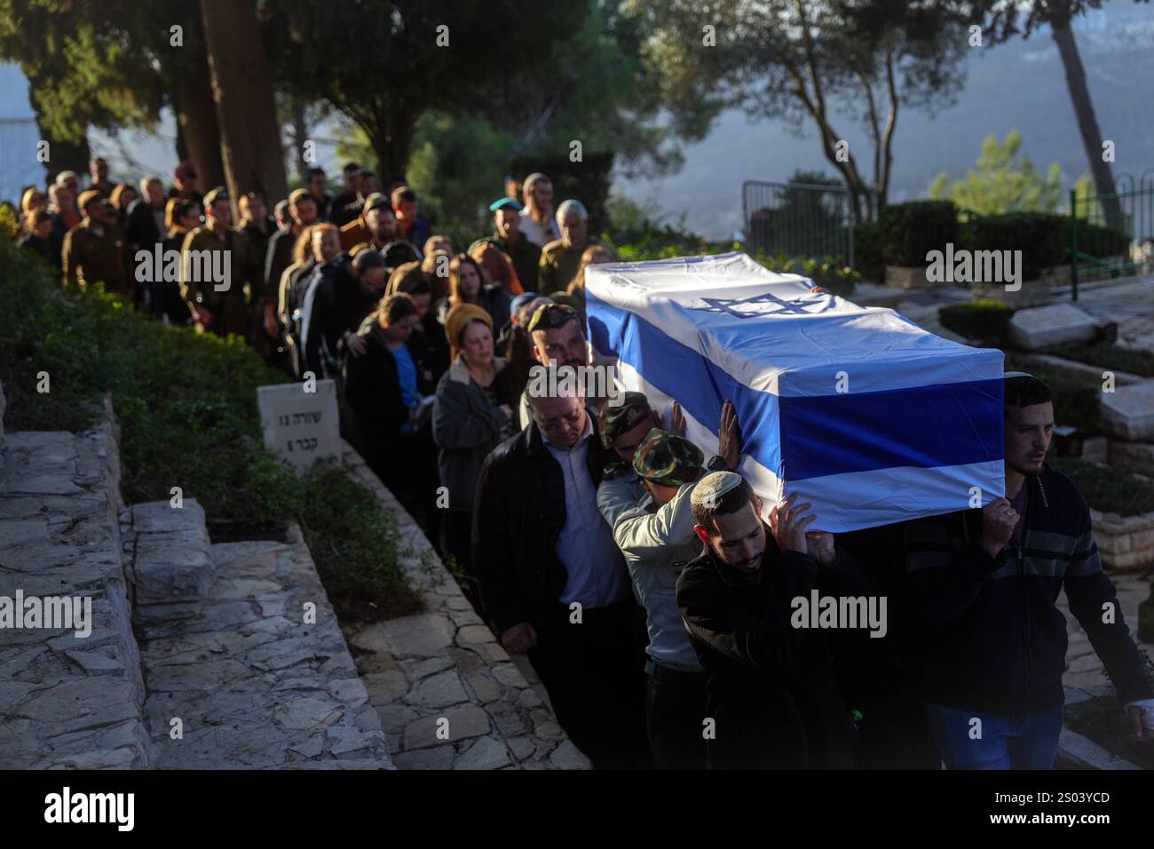 Israeli soldiers and relatives carry the flag-draped casket of 1st Sgt ...