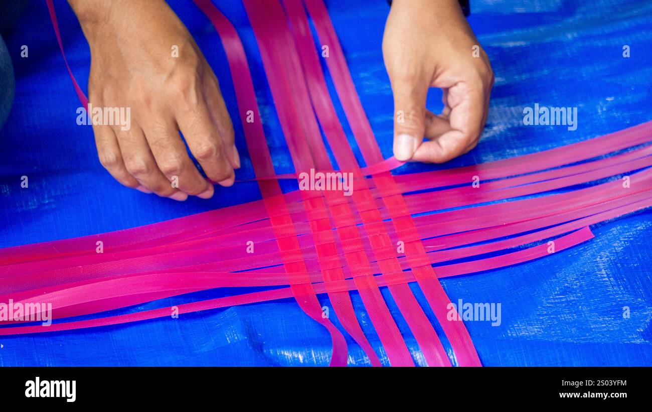 Create bags from woven plastic. Activities to reduce plastic waste ...