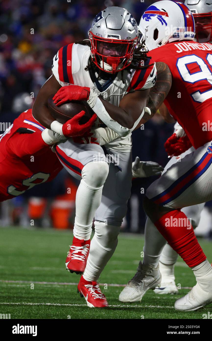 New England Patriots running back Rhamondre Stevenson (38) carries the ...