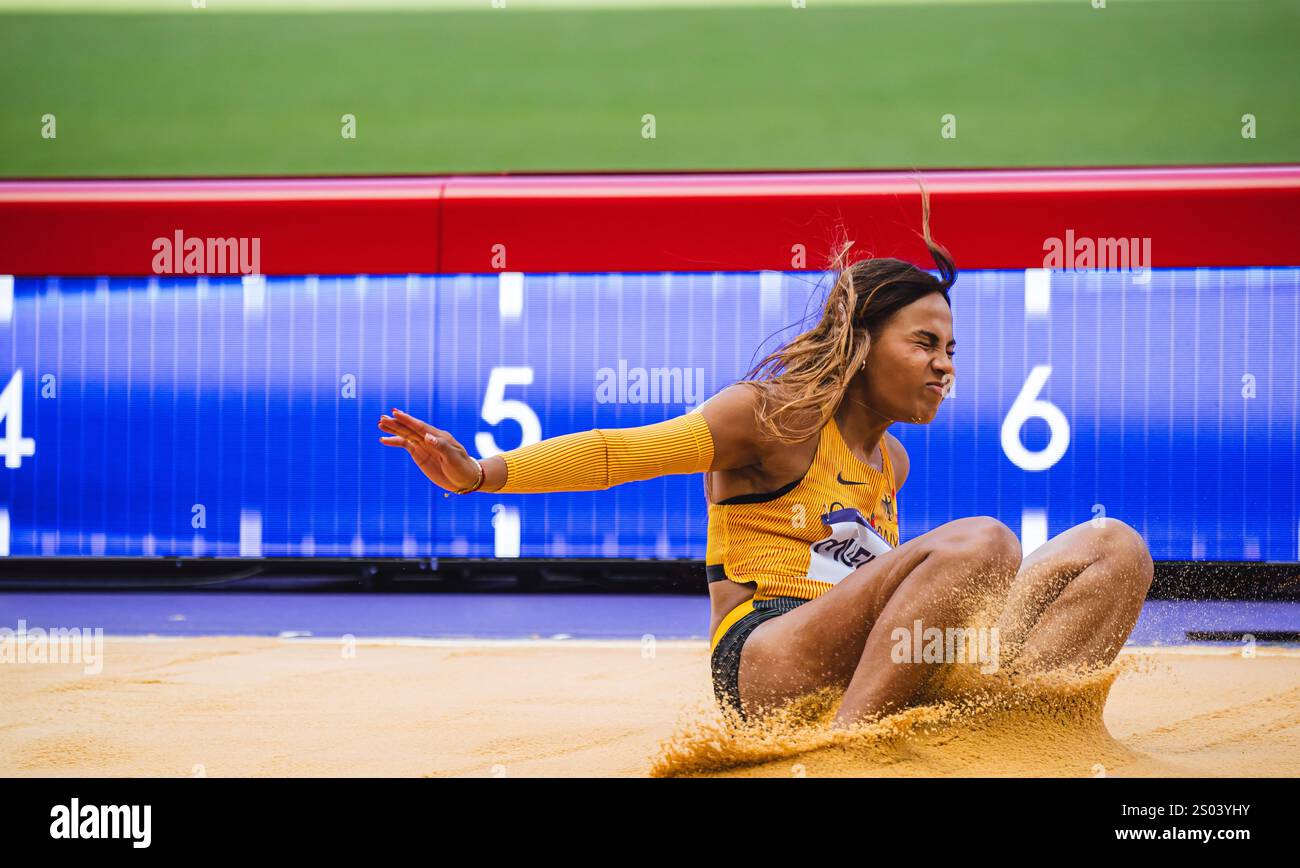 Mikaelle Assani participating in the long jump at the Paris 2024 ...