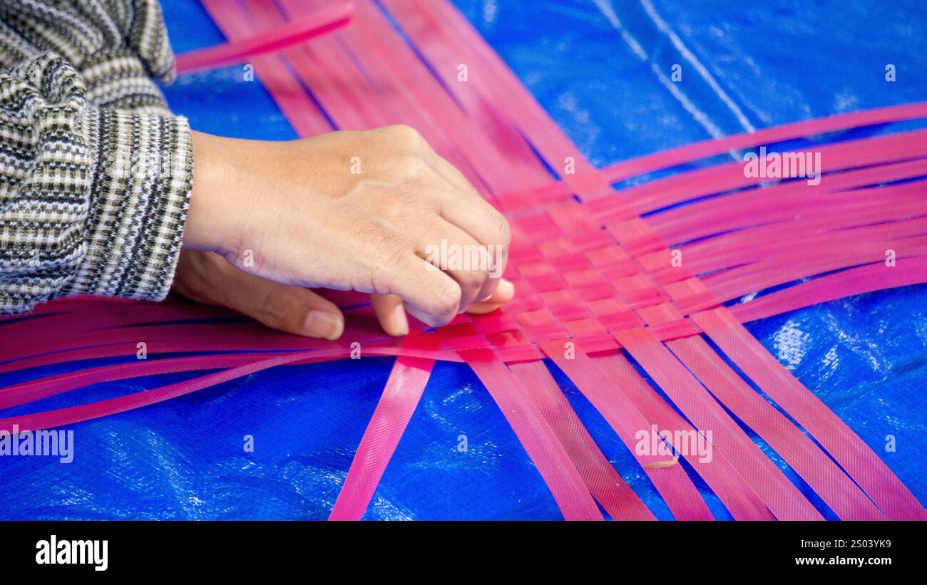 Create bags from woven plastic. Activities to reduce plastic waste ...
