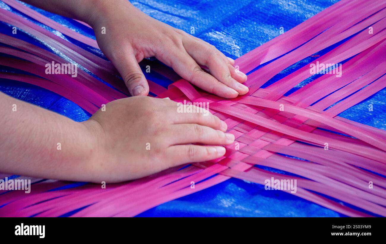 Create bags from woven plastic. Activities to reduce plastic waste ...