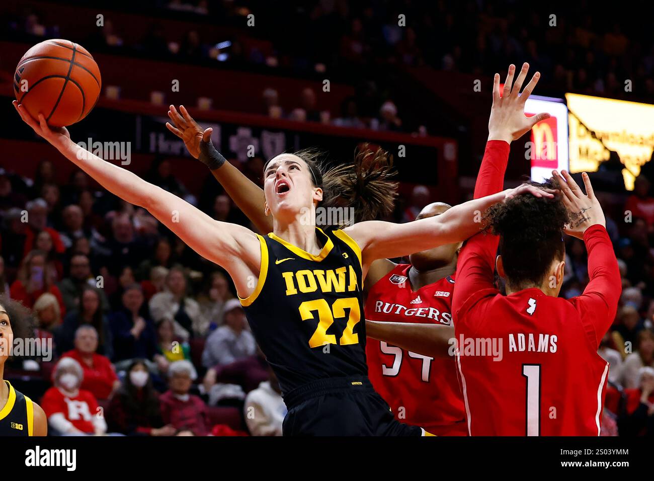FILE - Iowa guard Caitlin Clark (22) drives to the basket past Rutgers ...