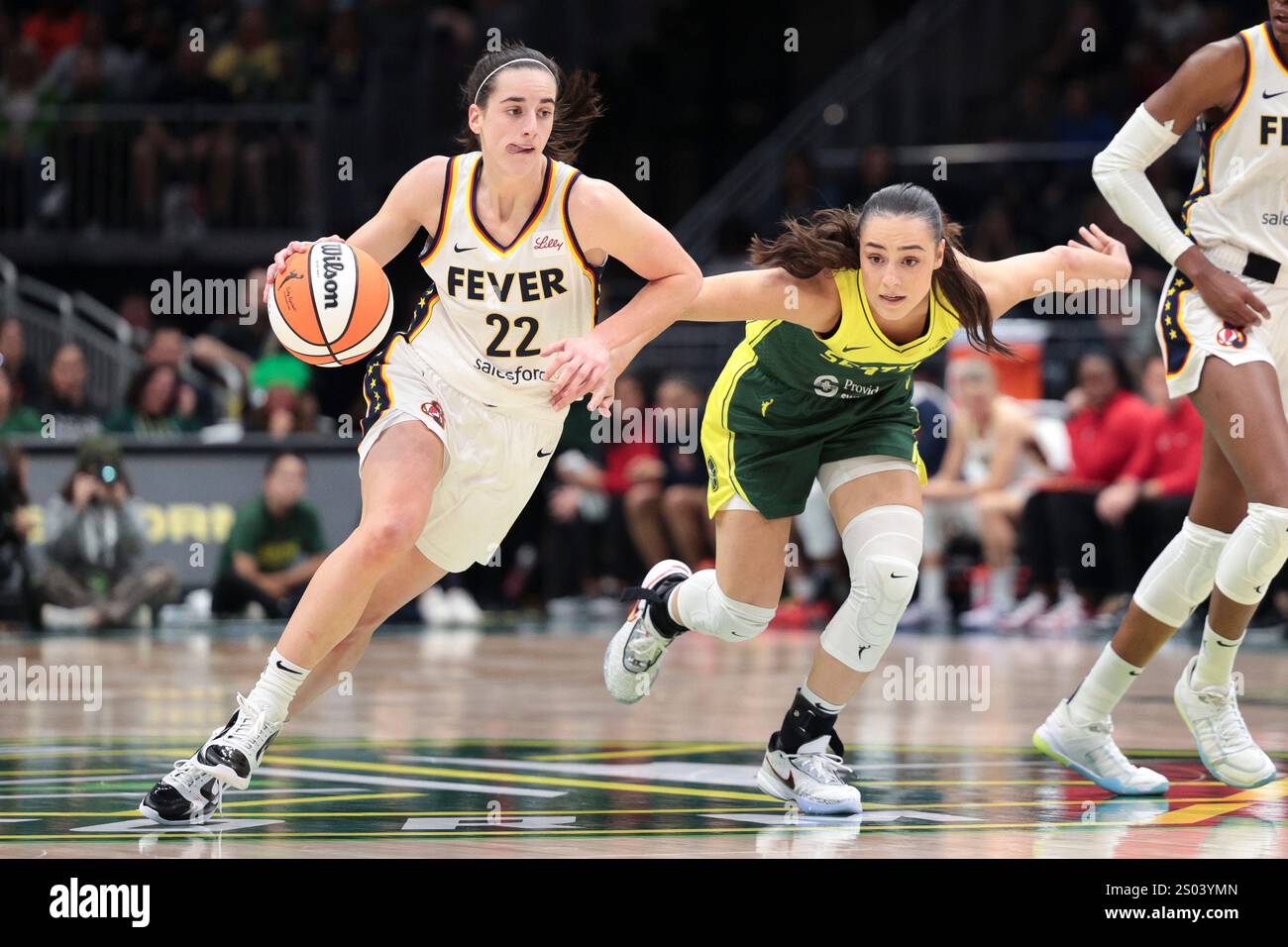 FILE - Indiana Fever guard Caitlin Clark (22) drives as Seattle Storm ...