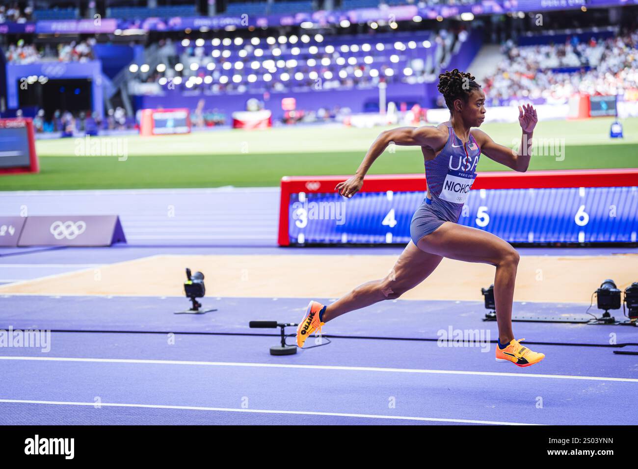 Monae' Nichols participating in the long jump at the Paris 2024 Olympic ...