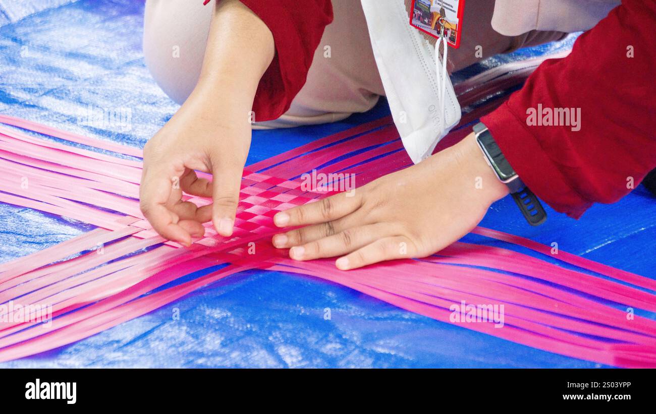 Create bags from woven plastic. Activities to reduce plastic waste ...