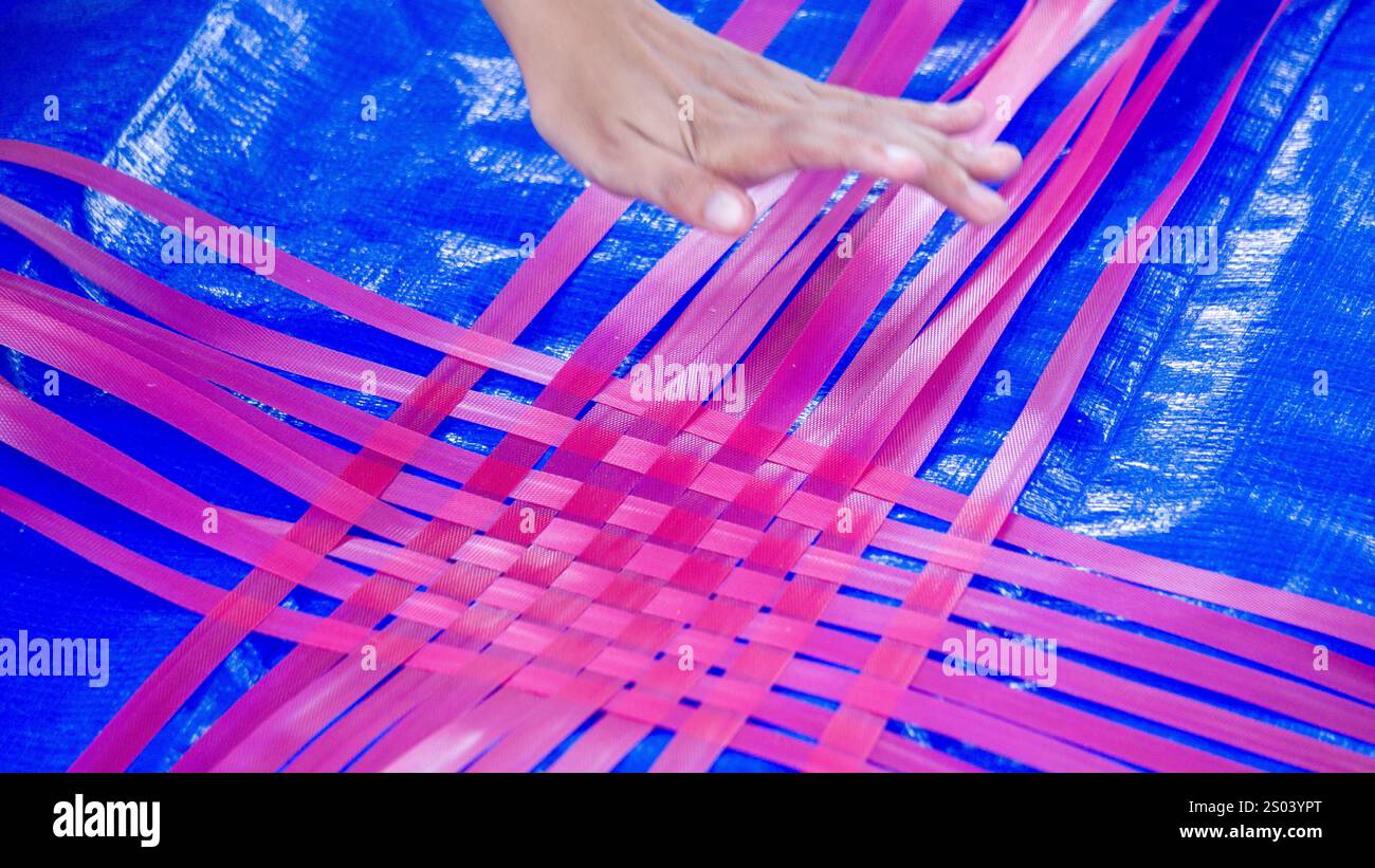 Create bags from woven plastic. Activities to reduce plastic waste ...