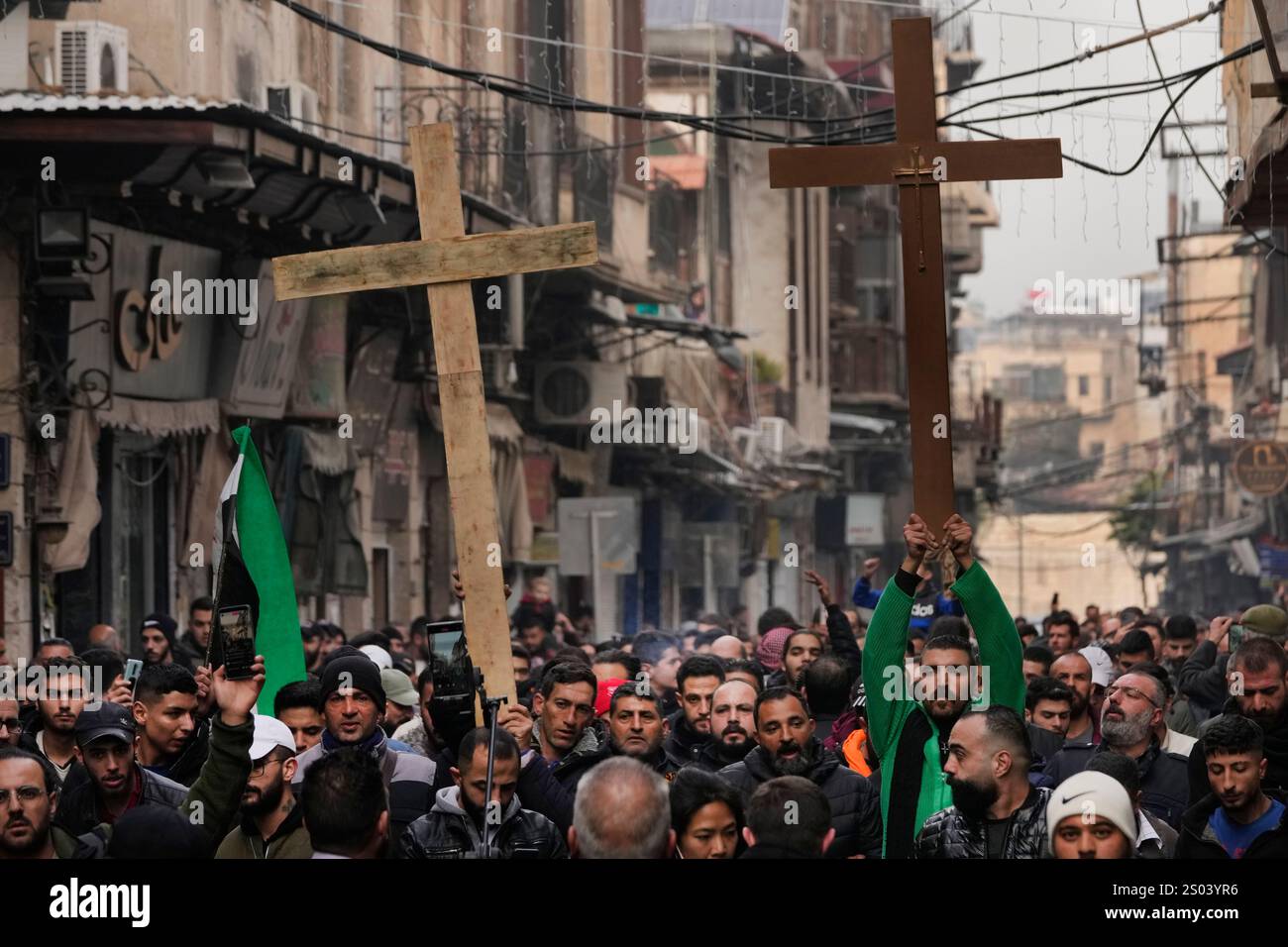 Syrian Christians hold up crosses and shout slogans in Damascus, Syria ...