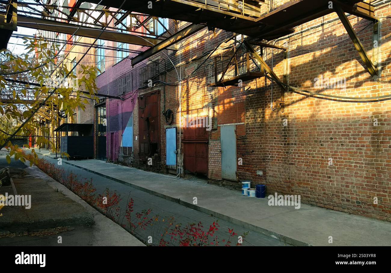 View of the backyard and the facade of the old factory Stock Photo - Alamy