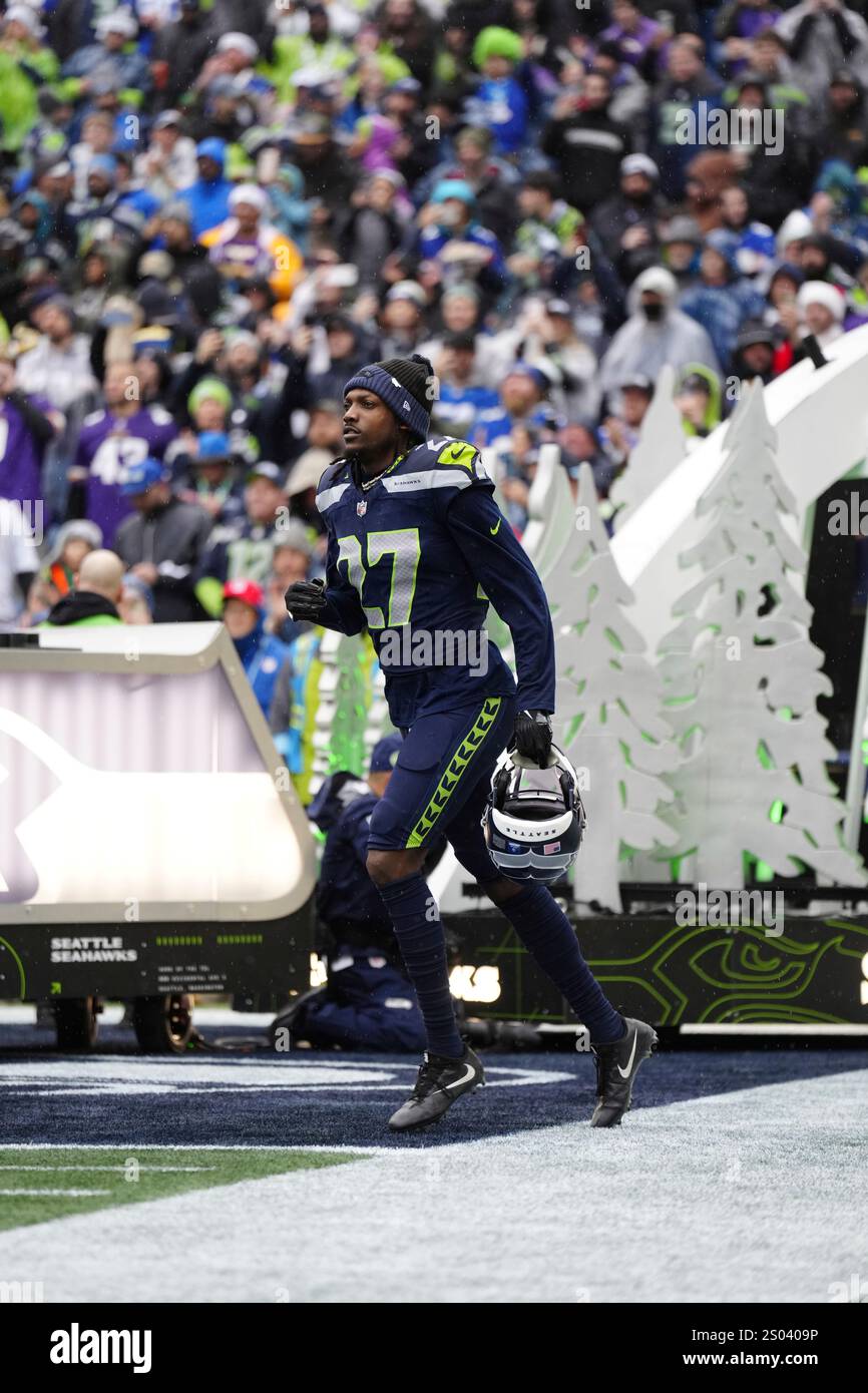 Seattle Seahawks cornerback Riq Woolen (27) runs onto the field before ...
